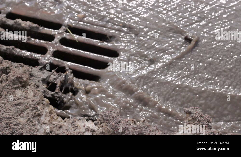 Water flows down manhole cover Stock Videos & Footage - HD and 4K Video ...