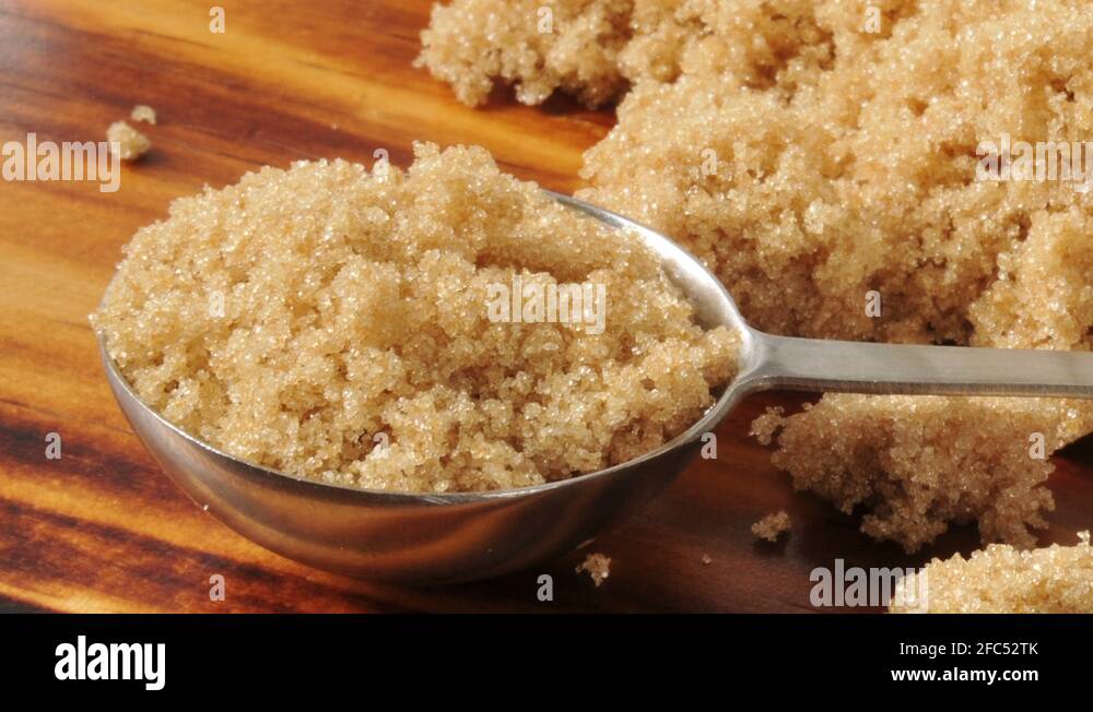Brown sugar spilling from a canister Stock Video Footage - Alamy