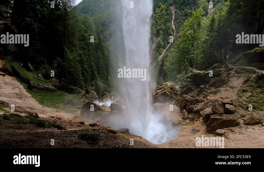 SLOWMO Falling water view under overhang of waterfall Pericnik Stock ...