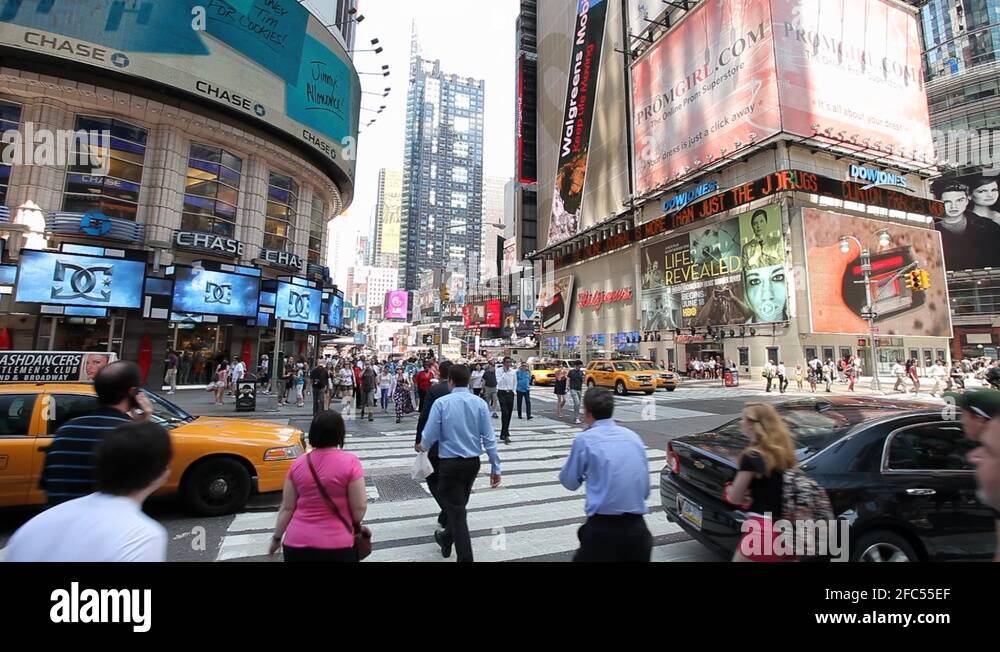 Times Square intersection people walking 24p Stock Video Footage - Alamy