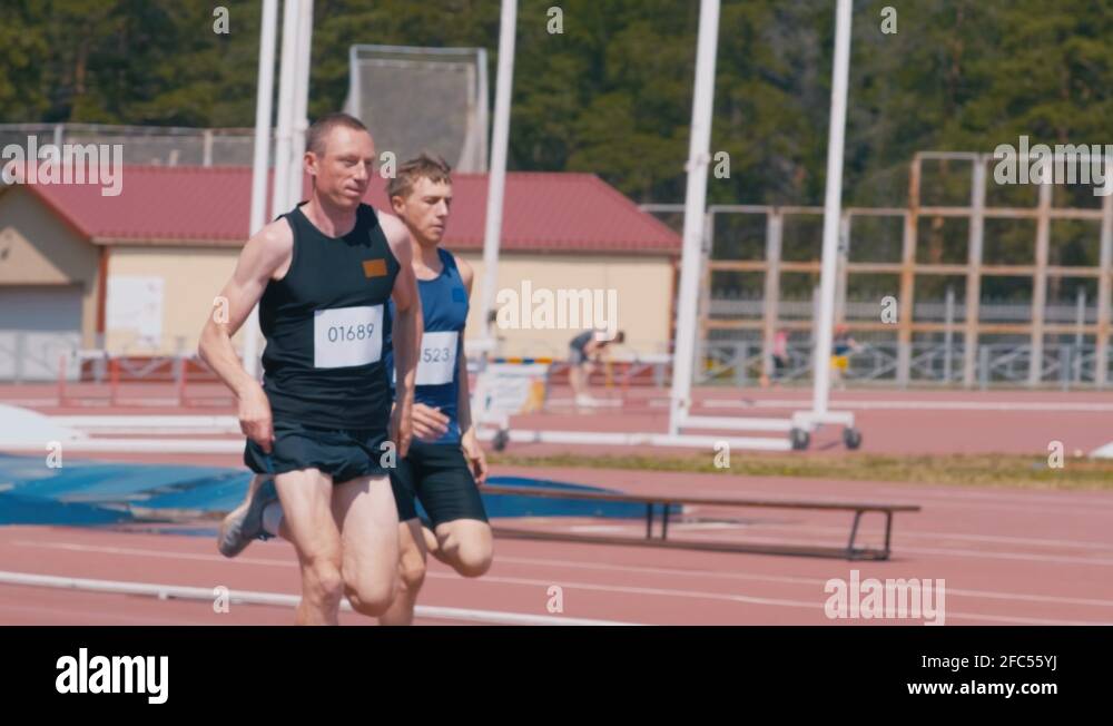 Male sprinter athletes training Stock Video Footage - Alamy