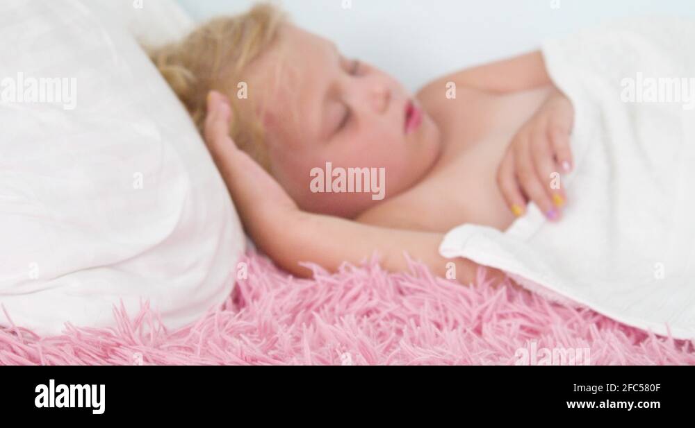 Close up beautiful little girl sleeping in her cot Stock Video Footage ...