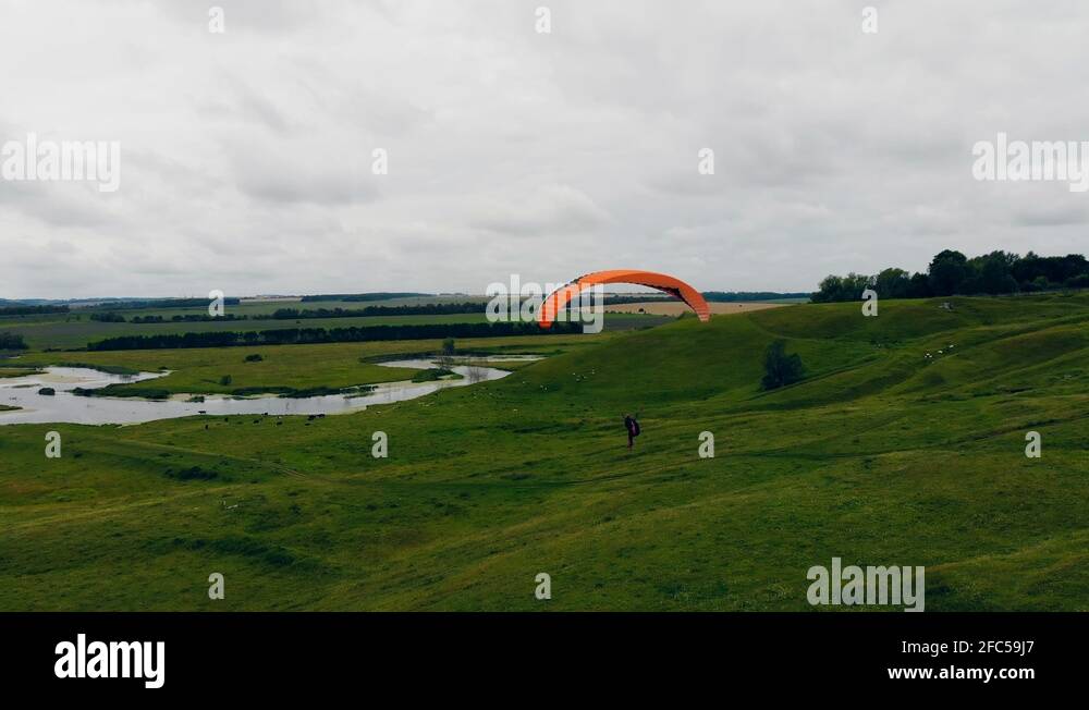 A person is flying the parawing in a top view Stock Video Footage - Alamy