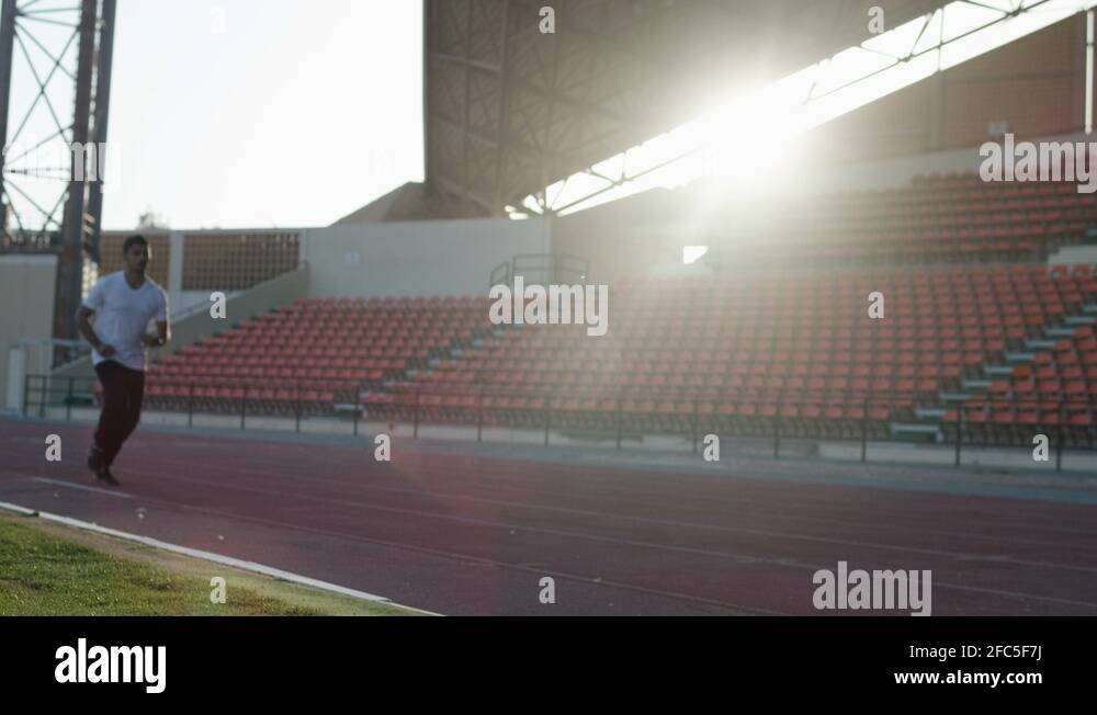 Saudi man running at the athletics track Stock Video Footage - Alamy