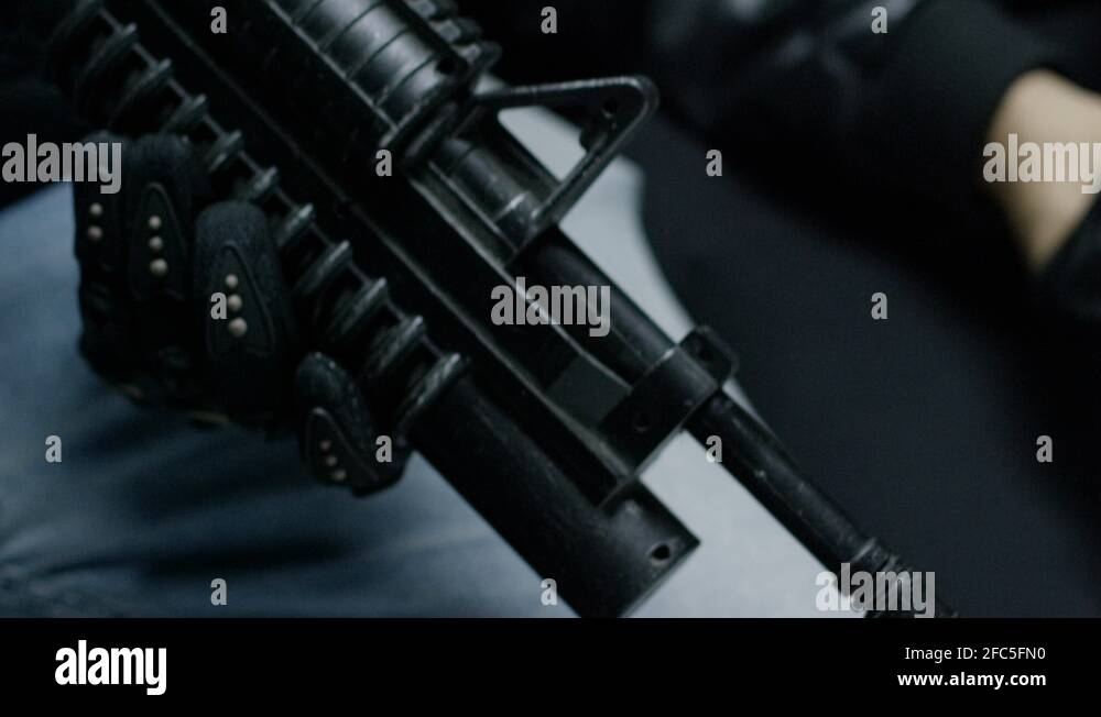 Close up of charging machine gun. Soldier reloading weapon Stock Video ...