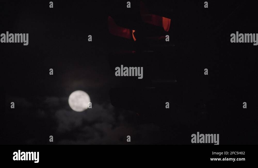 Traffic light night in front of Moon 4K Stock Video Footage - Alamy
