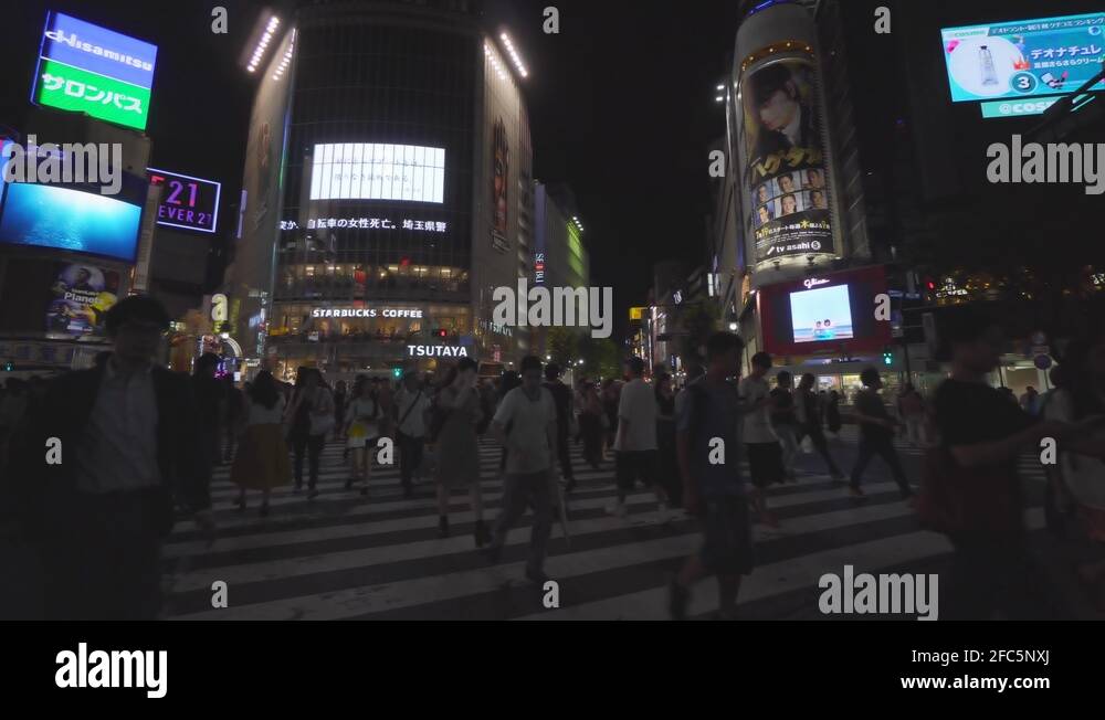 Night scene of people crossing intersection in Shibuya, Tokyo. Japan ...