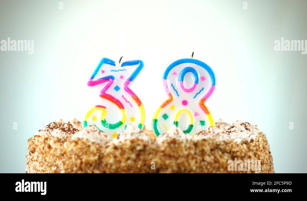 Birthday cake with a burning birthday candle. Number 38 Background ...
