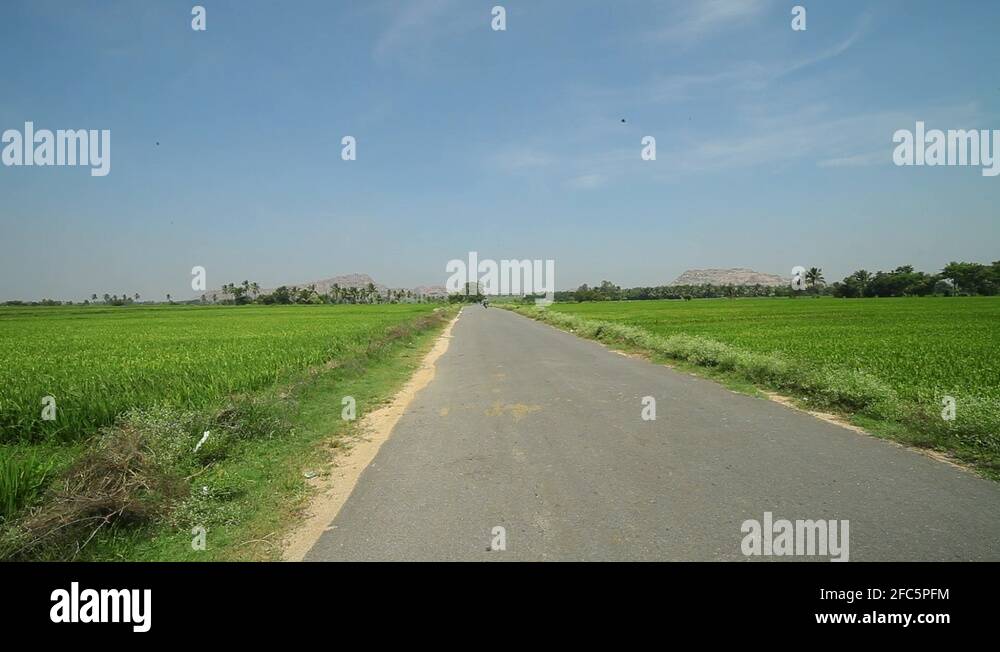 Village road through agricultural field Stock Videos & Footage - HD and ...