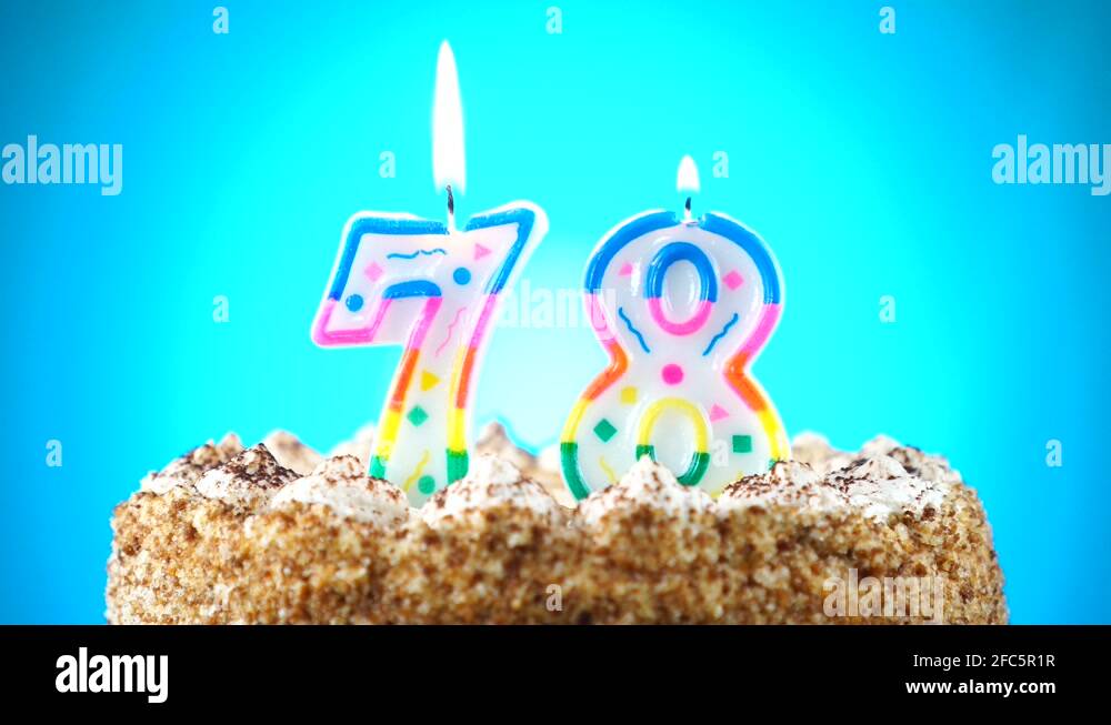 Birthday cake with a burning birthday candle. Number 78. Background ...