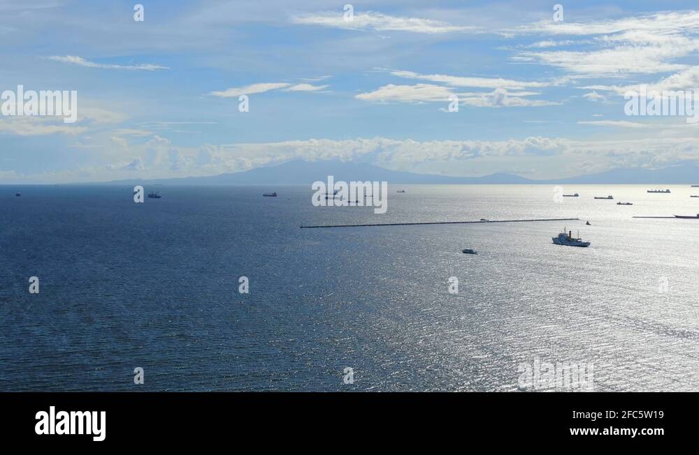 Rotating aerial view looking toward Manila bay,bay of the south China ...