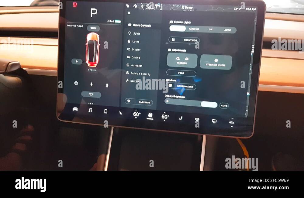 Passenger using Tesla Model 3 touchscreen in Tesla store in Stanford ...