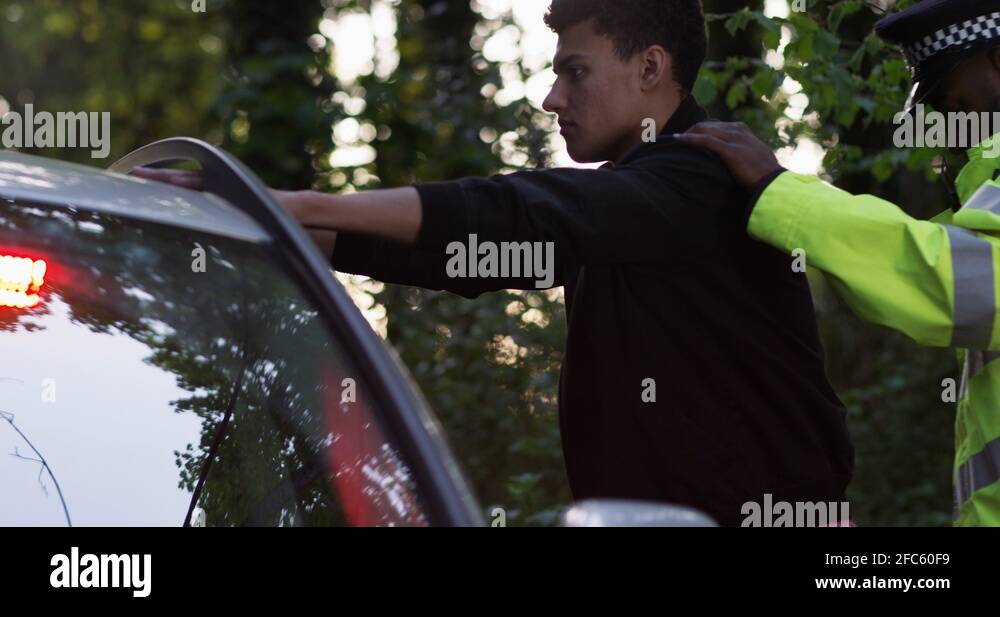 4K Crime suspect being arrested & handcuffed by police officer Stock ...