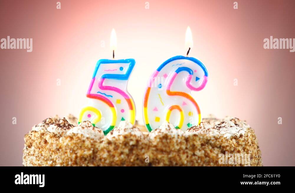 Birthday cake with a burning birthday candle. Number 56. Background ...