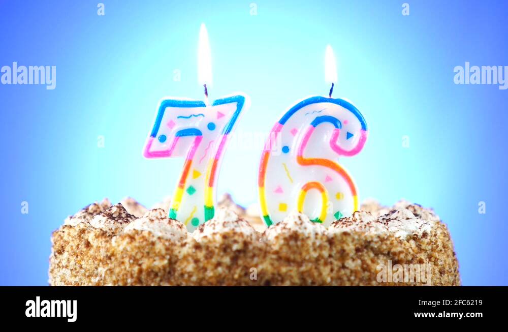 Birthday cake with a burning birthday candle. Number 76. Background ...