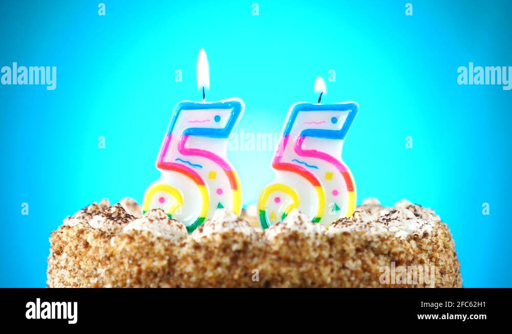 Birthday cake with a burning birthday candle. Number 55. Background ...