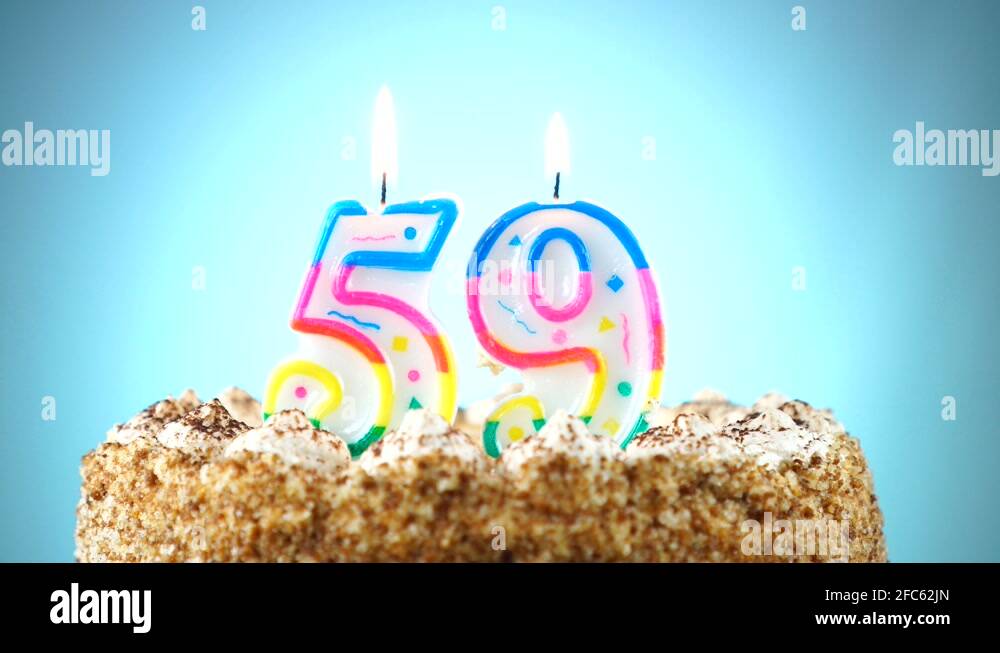 Birthday cake with a burning birthday candle. Number 59. Background ...