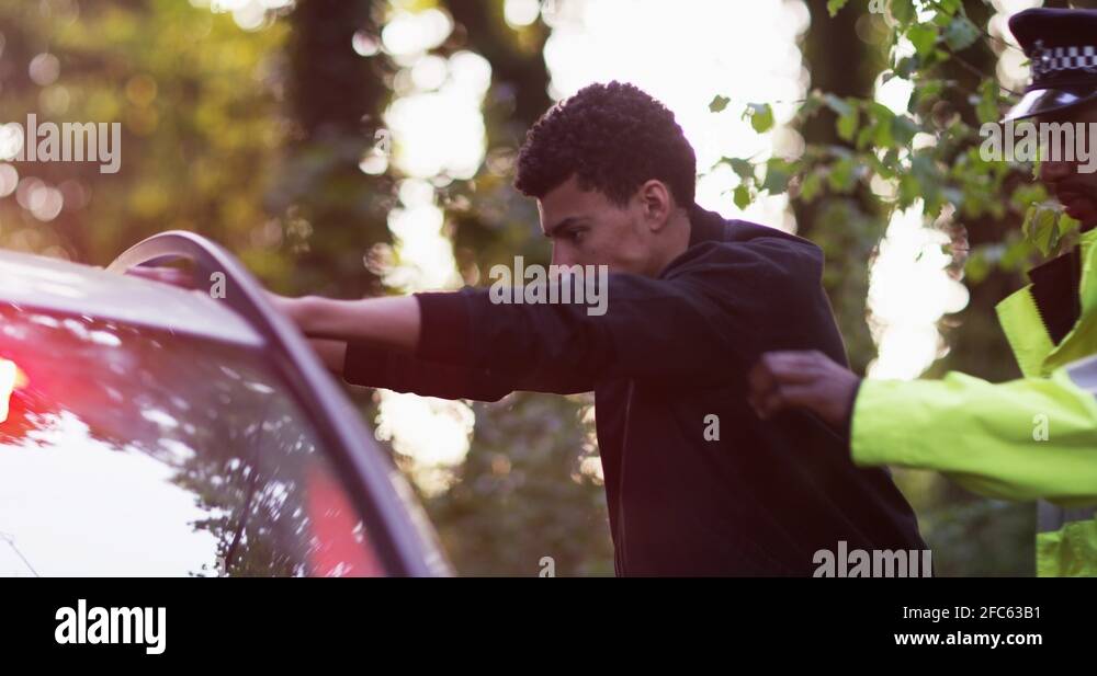 4K Crime suspect being arrested & handcuffed by police officer Stock ...