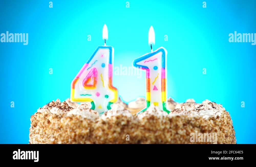 Birthday cake with a burning birthday candle. Number 41. Background ...