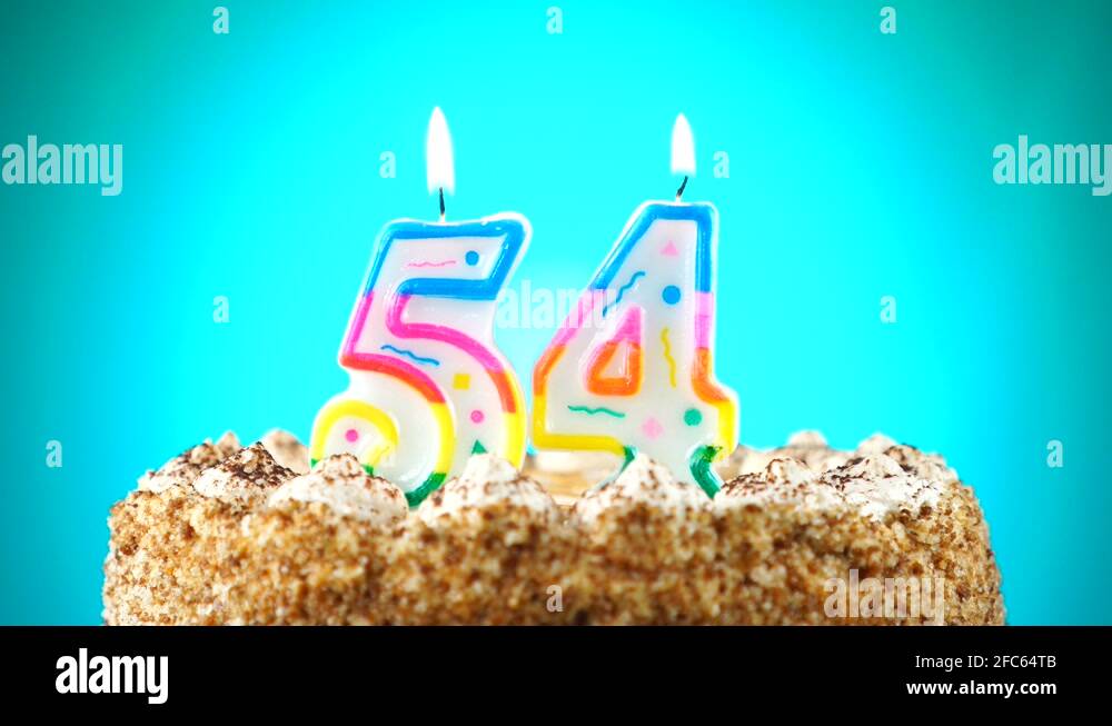 Birthday cake with a burning birthday candle. Number 54. Background ...