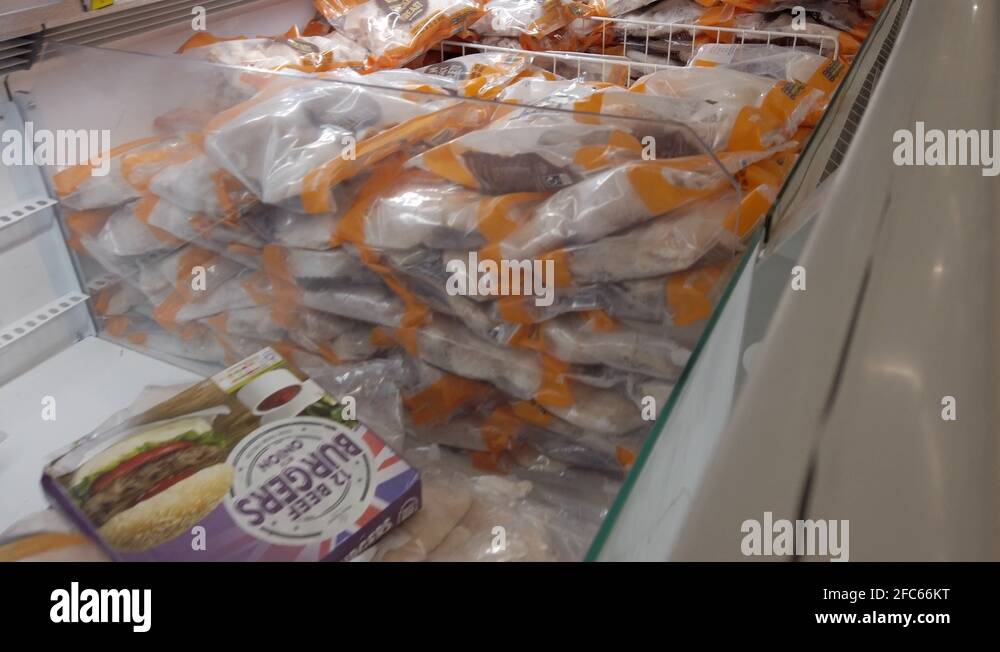Frozen food section in a food store aisle Stock Video Footage - Alamy