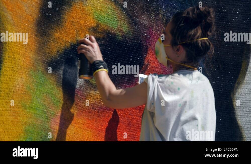 Amy Winehouse street art in the making, beautiful graffiti art being ...