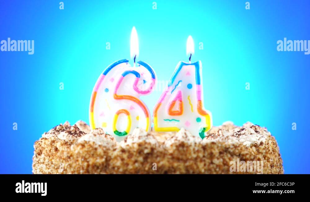 Birthday cake with a burning birthday candle. Number 64. Background ...