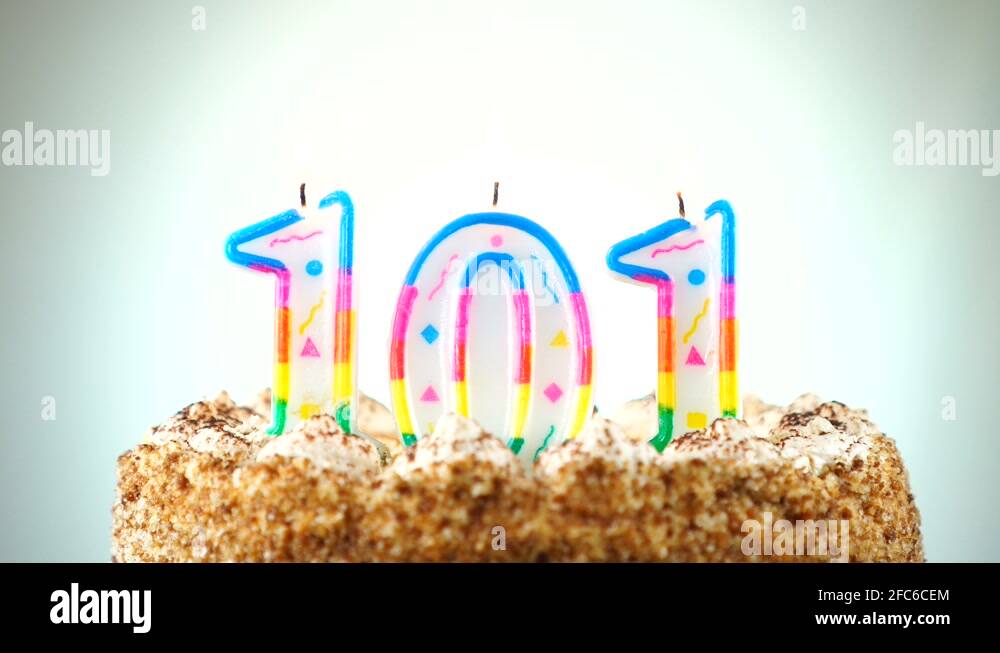 Birthday cake with a burning birthday candle. Number 101. Background ...