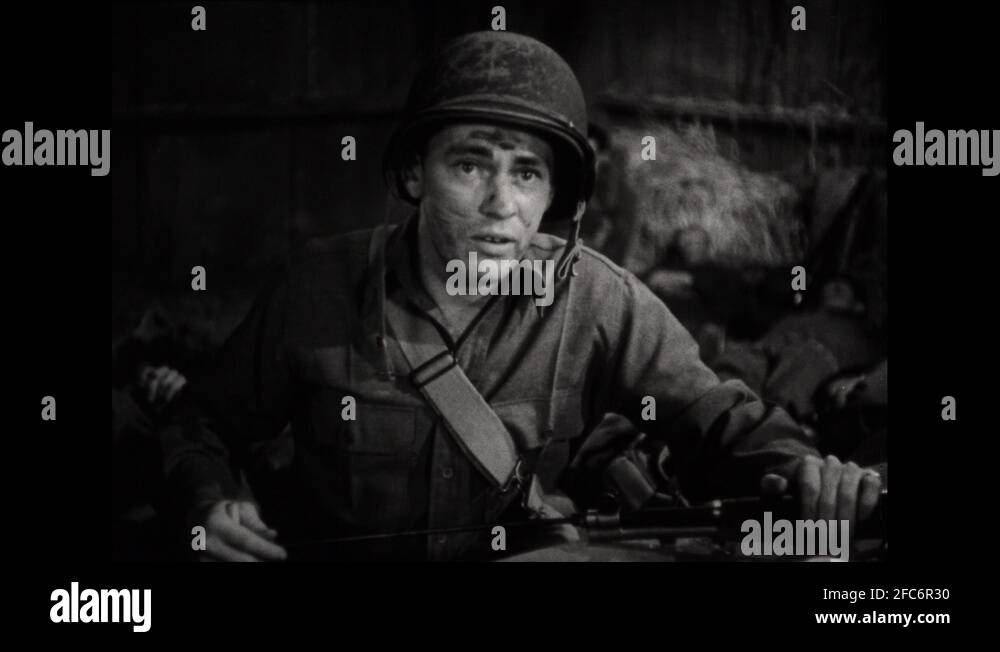 1940s: Soldier talking. Soldier putting parts of rifle together ...