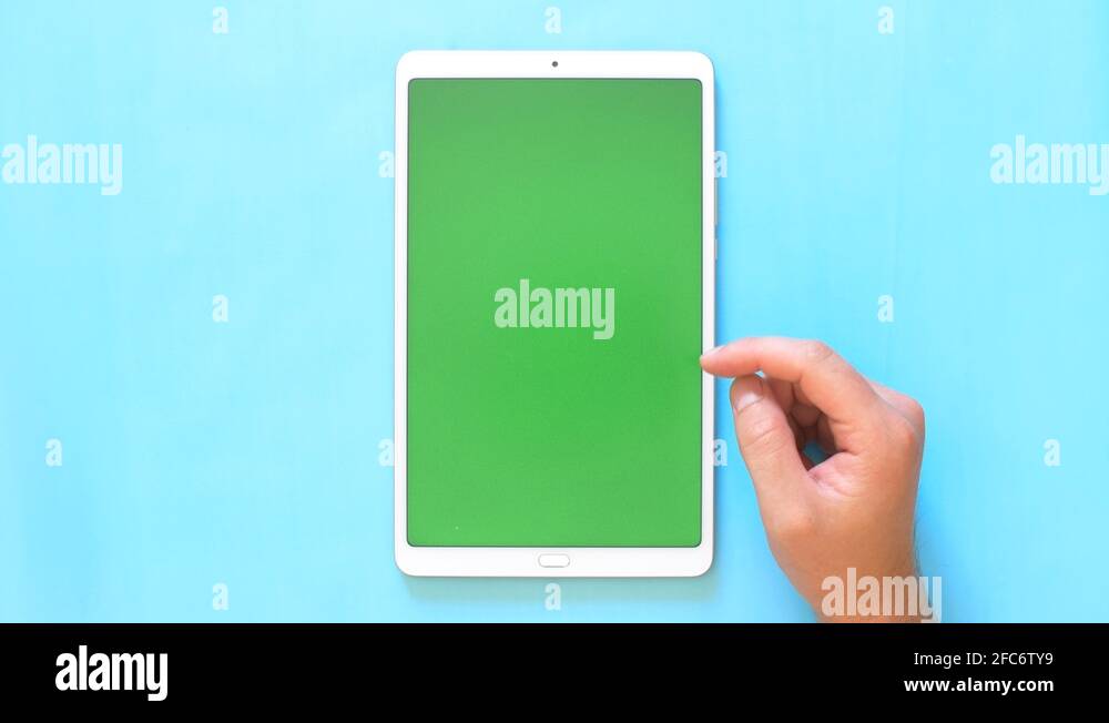 Man hands swipe on screen tablet. Top view. 4k green screen footage ...