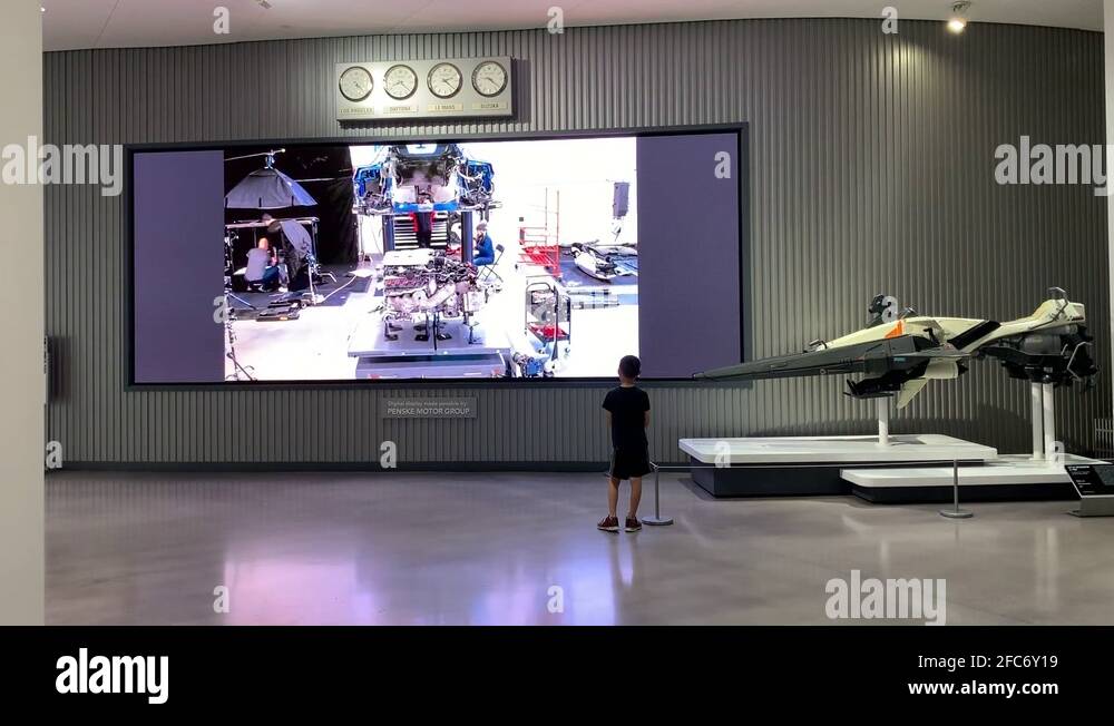 Boy watching a digital art display at an automotive museum in Los ...