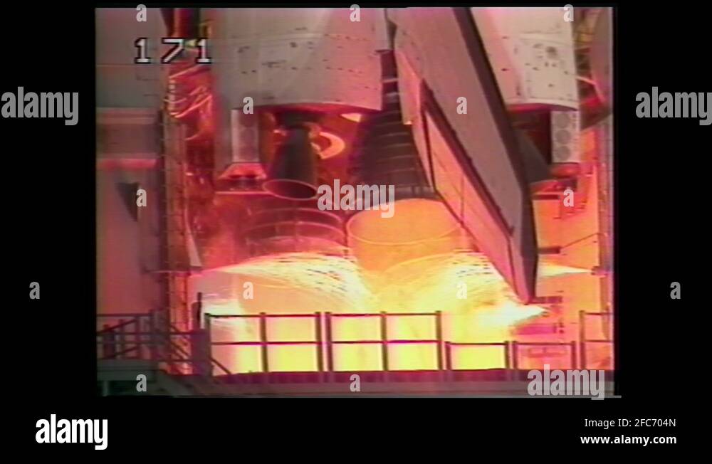 1990s: Engines fire from Space shuttle on launch pad. Space shuttle ...