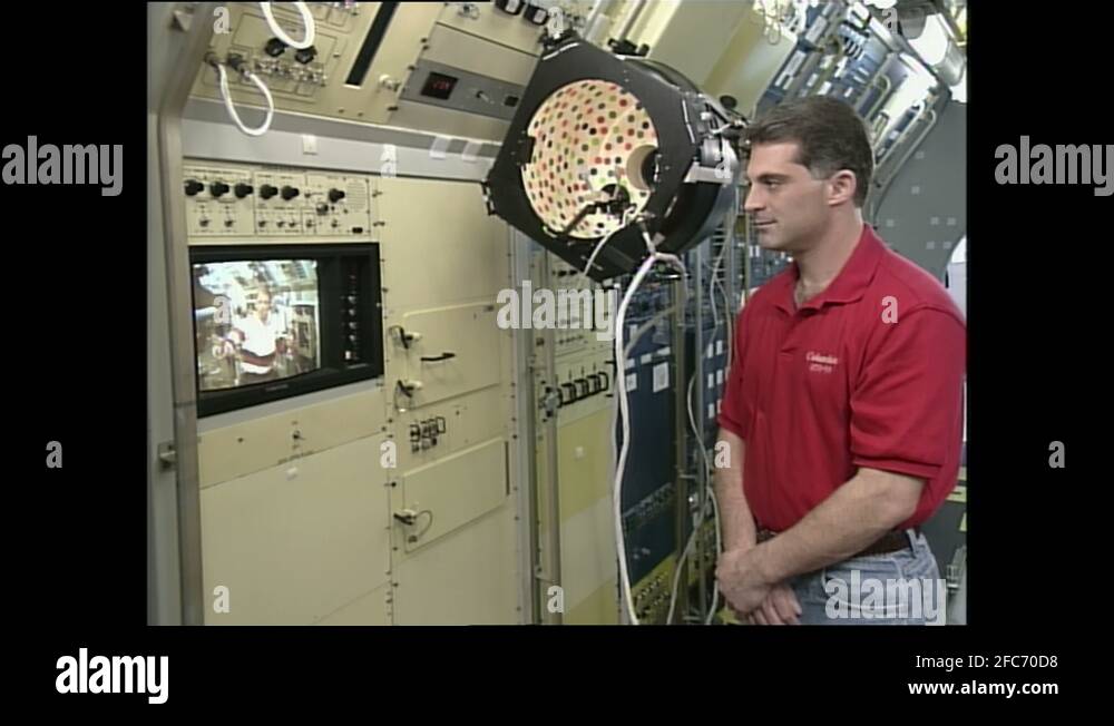 1990s: Man stands talking to man in space shuttle on television then ...