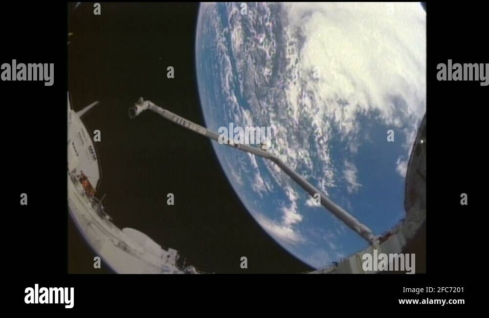 1990s: Automated arm moves in space. Earth's surface. Machine. Traffic ...