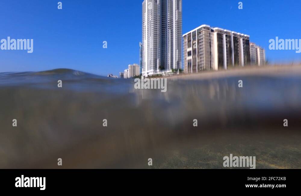 Slow motion underwater view of seabed floor ocean tidal wave reveals ...
