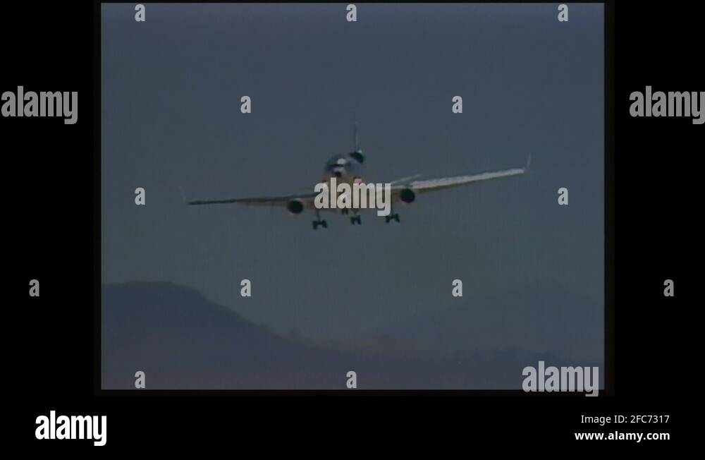 1990s: Plane landing, credits. Animation of spacecraft. Spacecraft ...