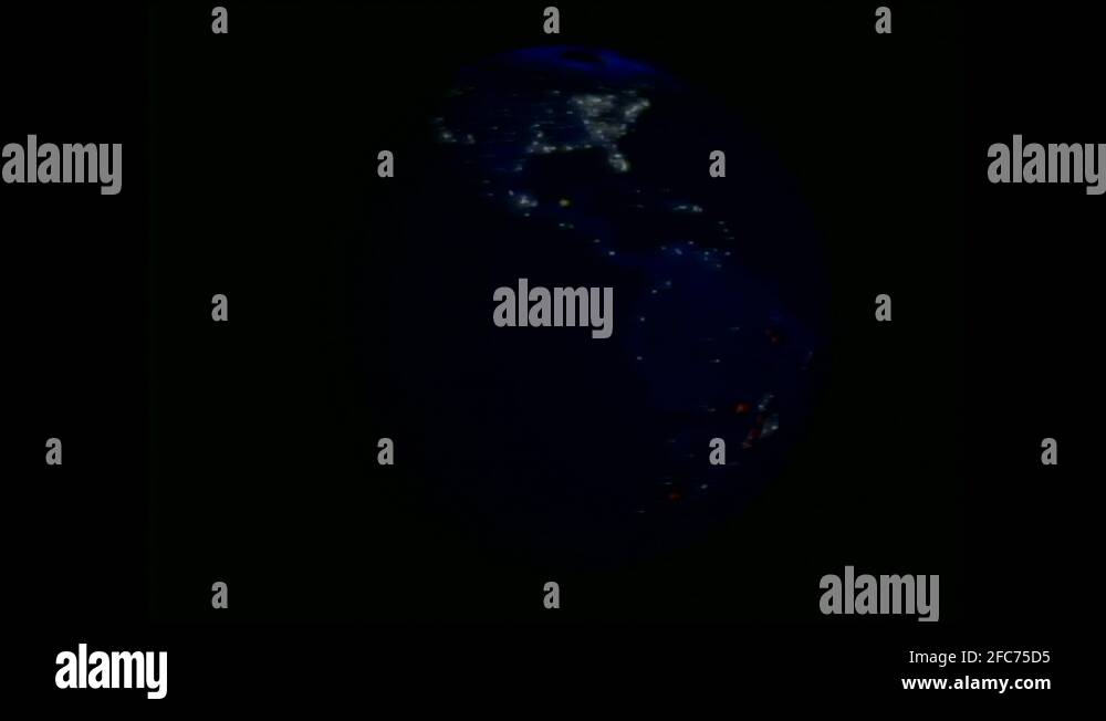1990s: Globe of earth rotating during night with lights from cities and ...