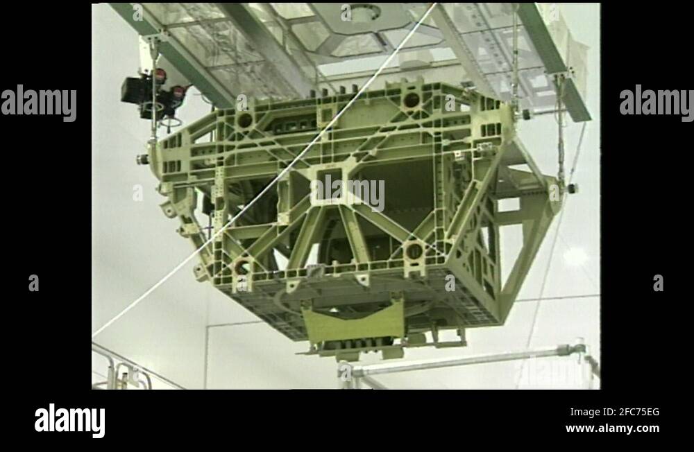 1990s: Piece of Space Station is carried by crane across factory ...