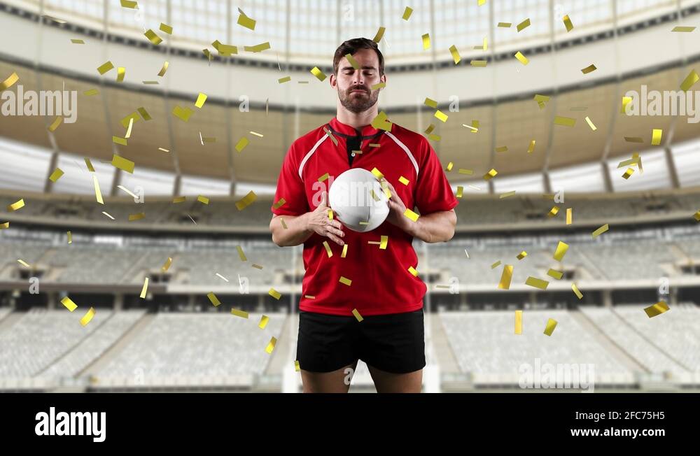 Professional rugby player standing in front of a stadium with confetti ...
