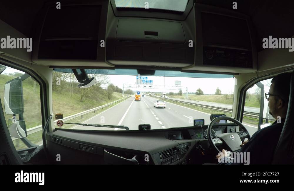 In cab view of a HGV driver on the M6 motorway using the slip road to ...