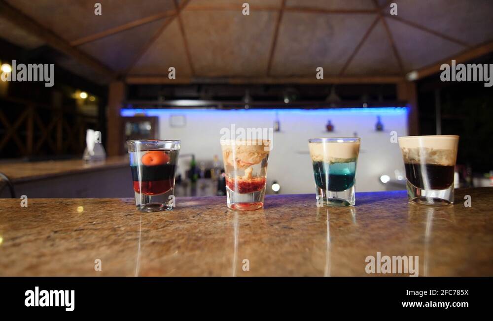 Four types of alcohol shots ready to drink Stock Video Footage - Alamy