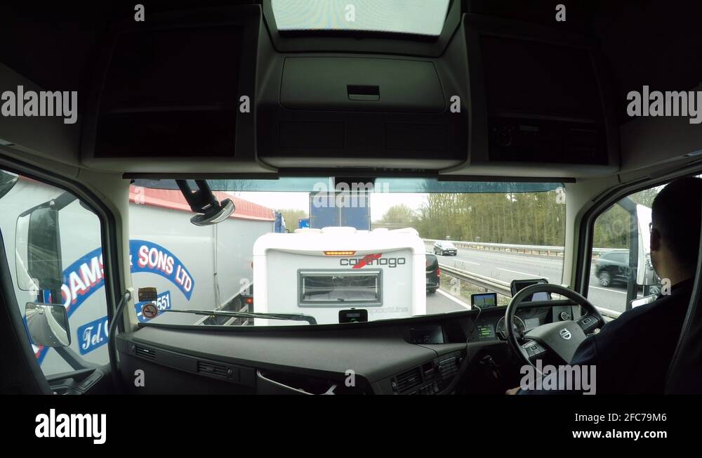 In cab view of a HGV driver in a queue of traffic on the M1 motorway ...