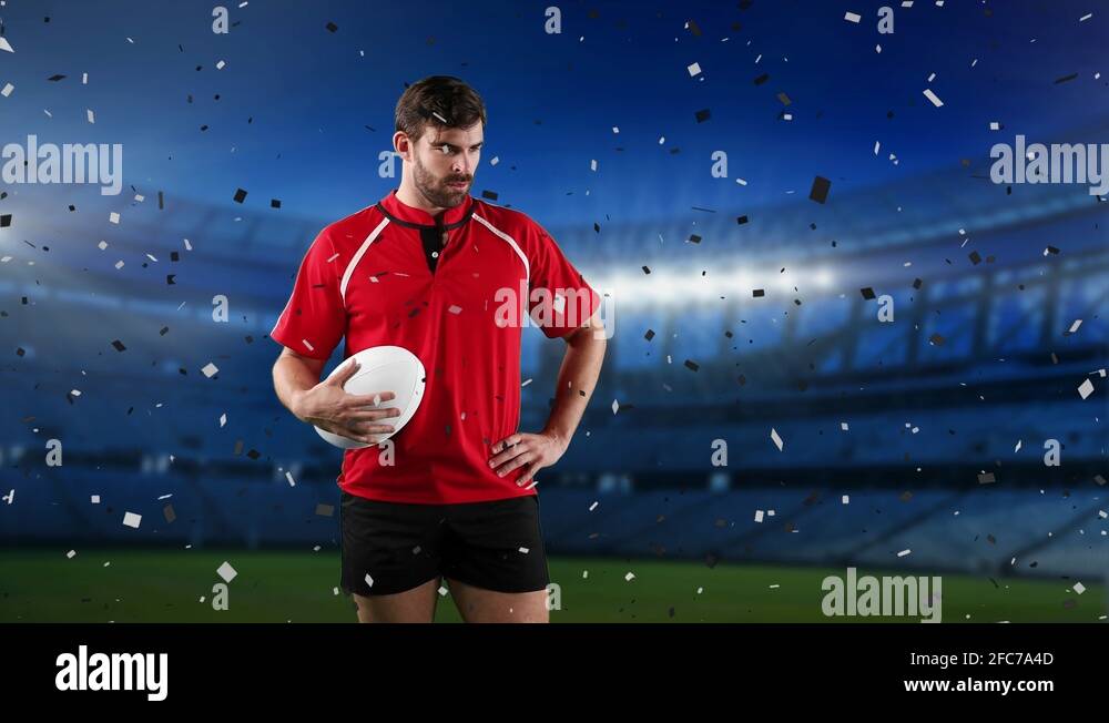 Professional rugby player standing in front of a stadium with confetti ...