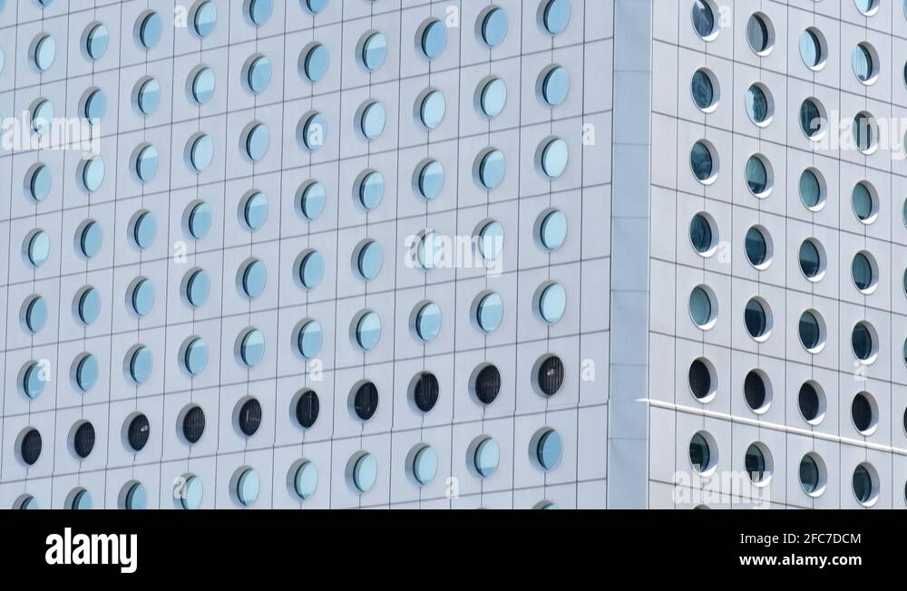 Tilt shot of modern high-rise office building with a glass facade Stock ...