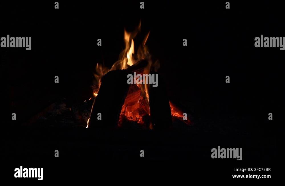 A big braai/barbeque fire with big flames and sparks Stock Video ...