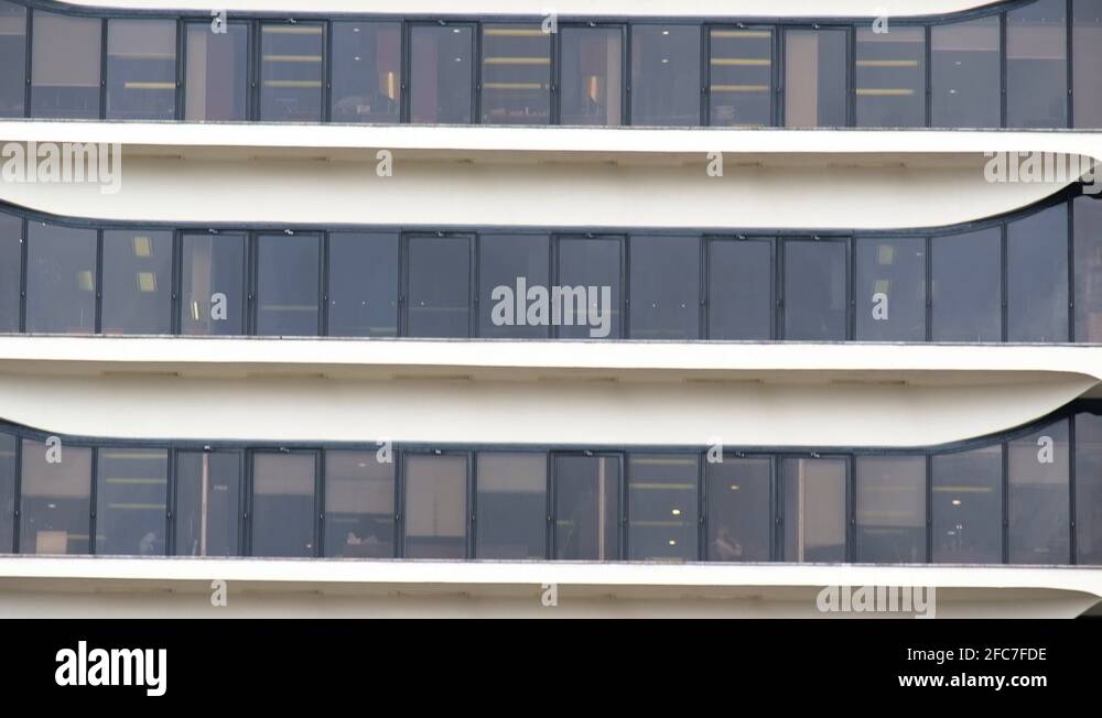 Tilt shot of modern high-rise office building with a glass facade Stock ...