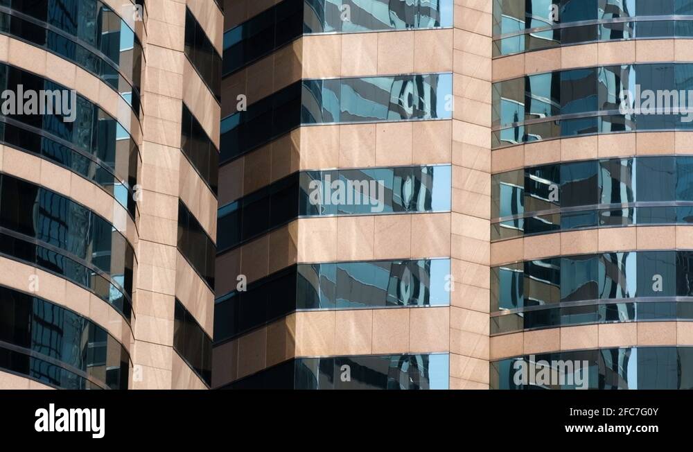 Tilt shot of modern high-rise office building with a glass facade Stock ...