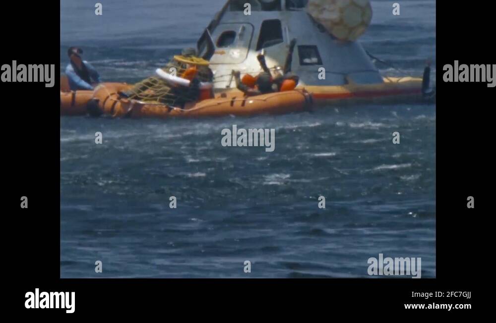 Apollo 11 - Astronaut in rescue basket is lift up by helicoter Stock ...