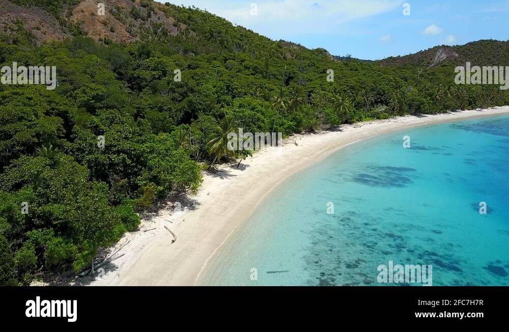 Aerial of Stunning Lush Green Tropical Beach, Raja Ampat Islands ...