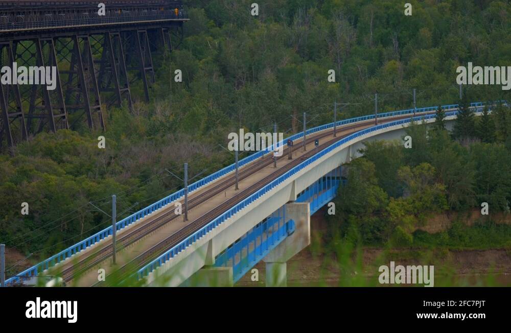 Edmonton Light Rail Train crossing the River Valley on a summer's ...